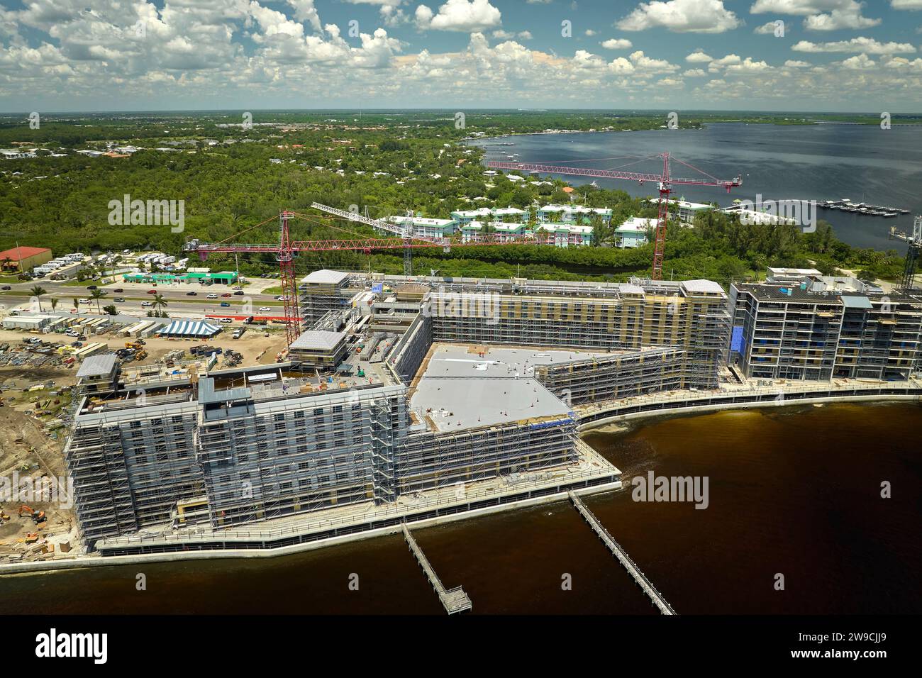 Aerial view of tower cranes and frame structure of high residential ...