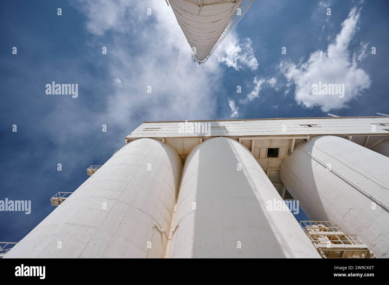 Brick chimney and concrete silos for limestone storage Stock Photo - Alamy