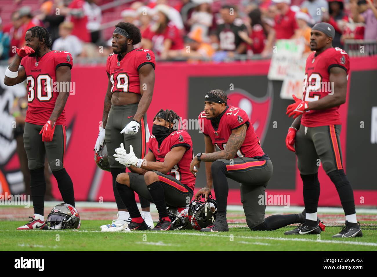 Players of the Tampa Bay Buccaneers defense wait for coaches to begin ...
