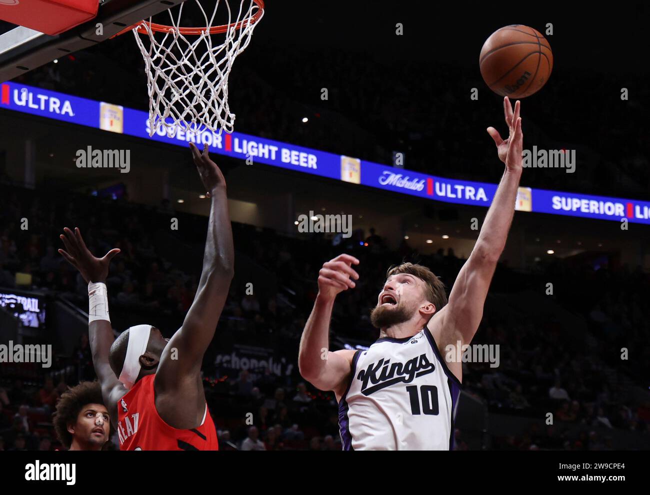 Sacramento Kings forward Domantas Sabonis, right, shoots against ...