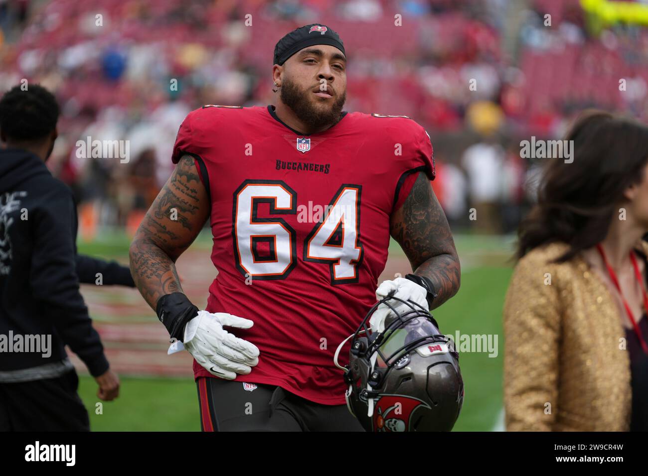 Tampa Bay Buccaneers guard Aaron Stinnie (64) leaves the field ...