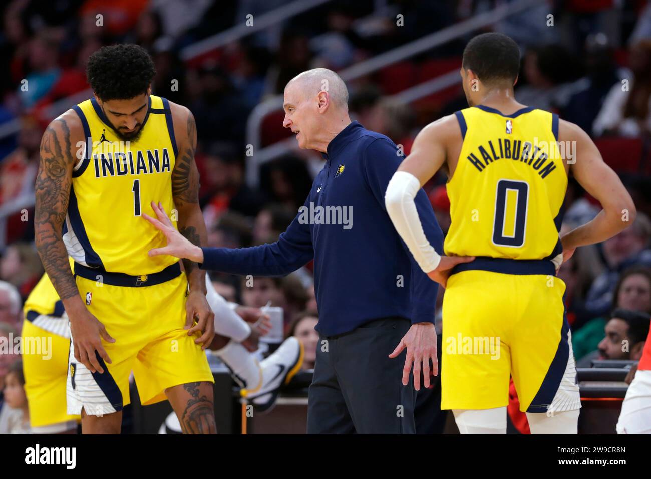 Indiana Pacers coach Rick Carlisle, center, talks with forward Obi ...