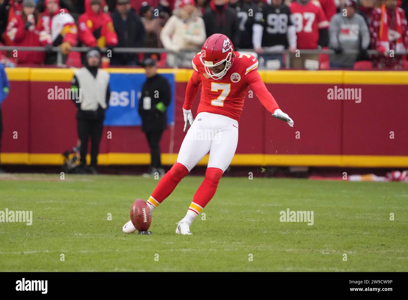 Kansas City Chiefs place kicker Harrison Butker (7) kicks the ball on a ...
