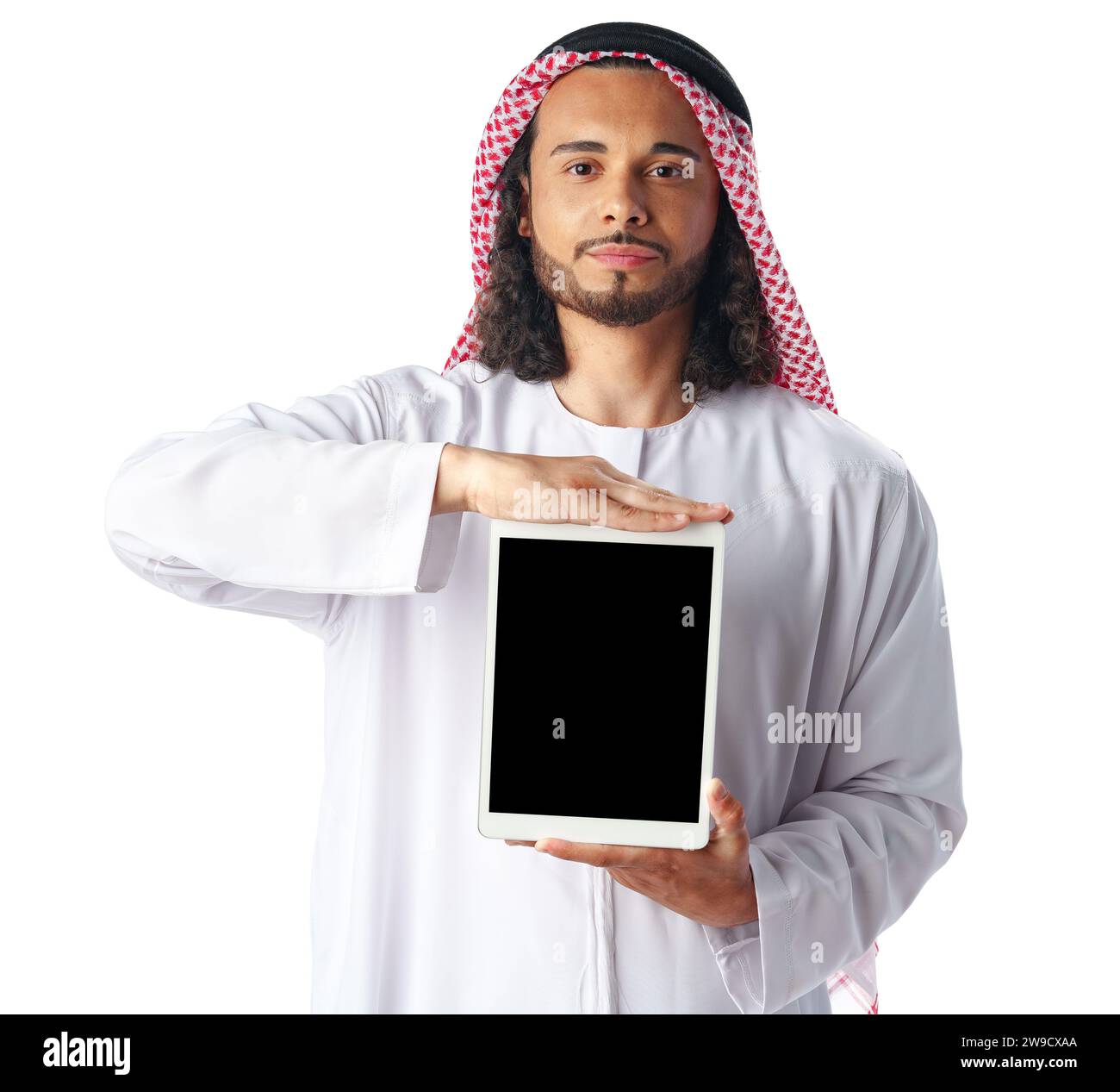 Young Arab man in traditional dress thobe showing digital tablet with ...