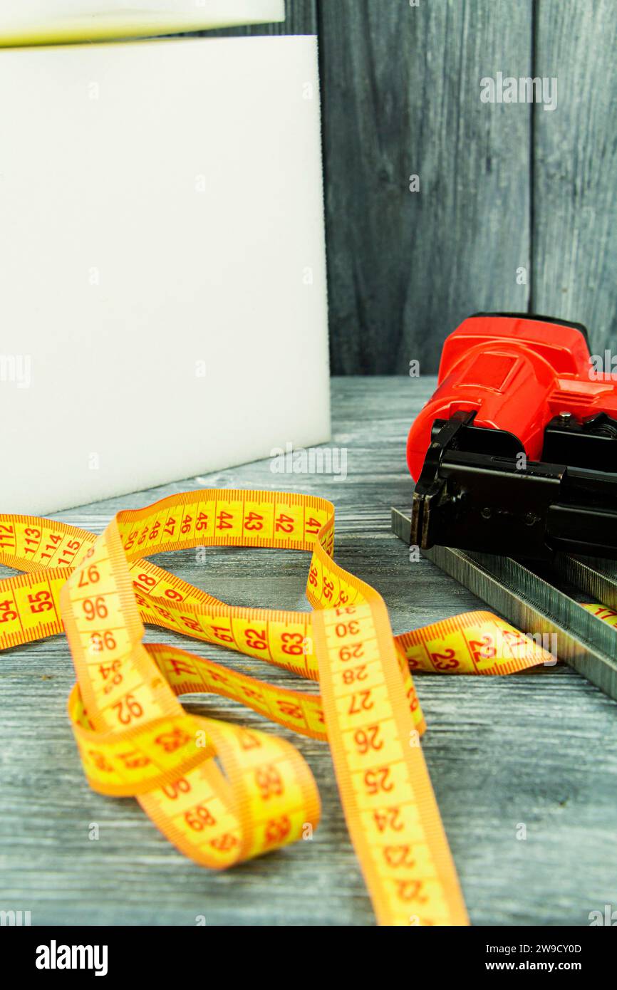 concept of furniture production and repair. Stapler and staples ...