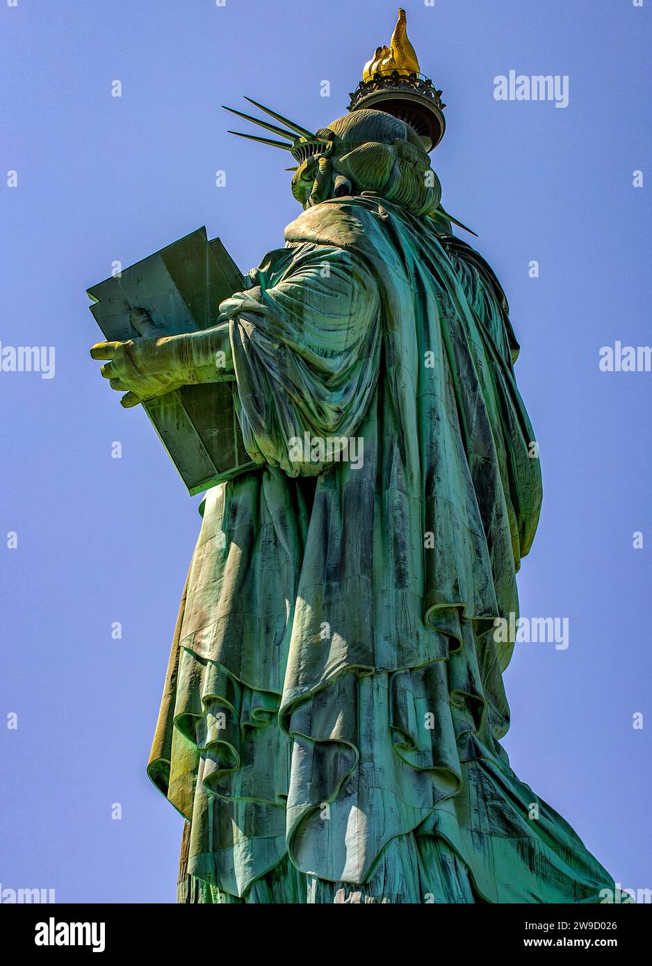 Great back vertical photo of the Statue of Liberty holding her torch on ...