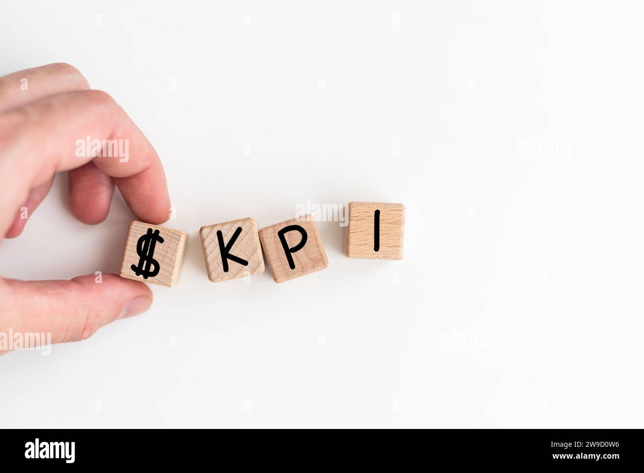 Wooden blocks with the lettering Money kpi on top of ascending bar ...