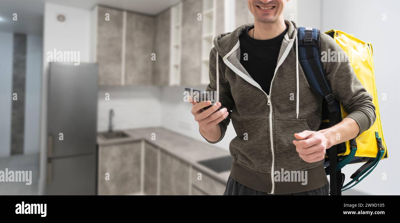 Delivery employee man hold thermal bag backpack with food work as ...