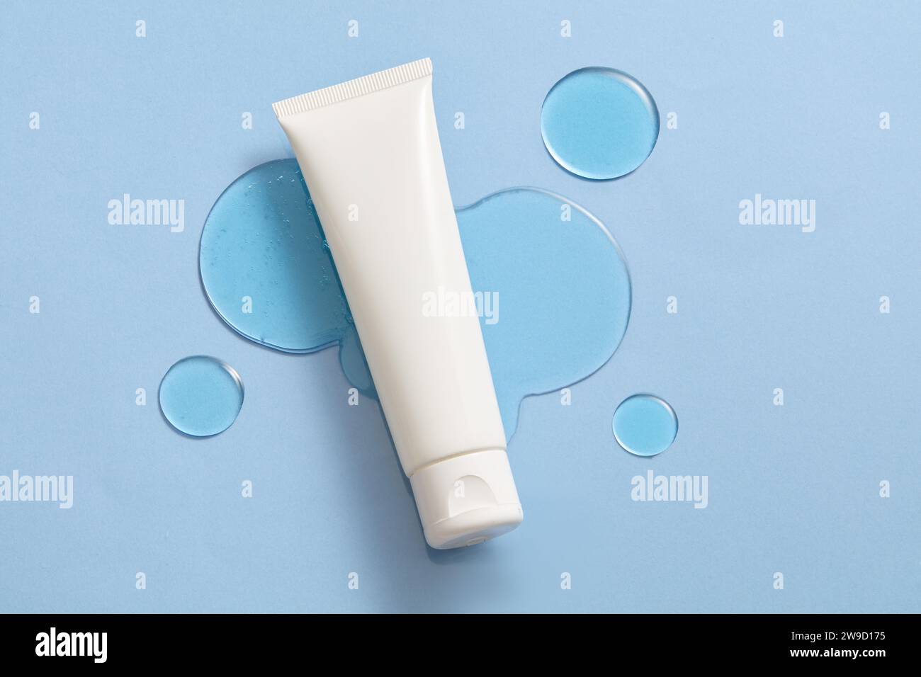 Top view of a white tube without label with lid open product squeezed ...