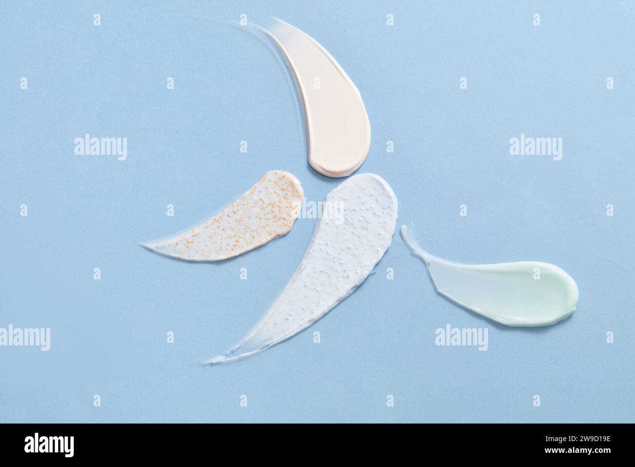 Various cosmetic textures, including face cream, serum, and lotion ...