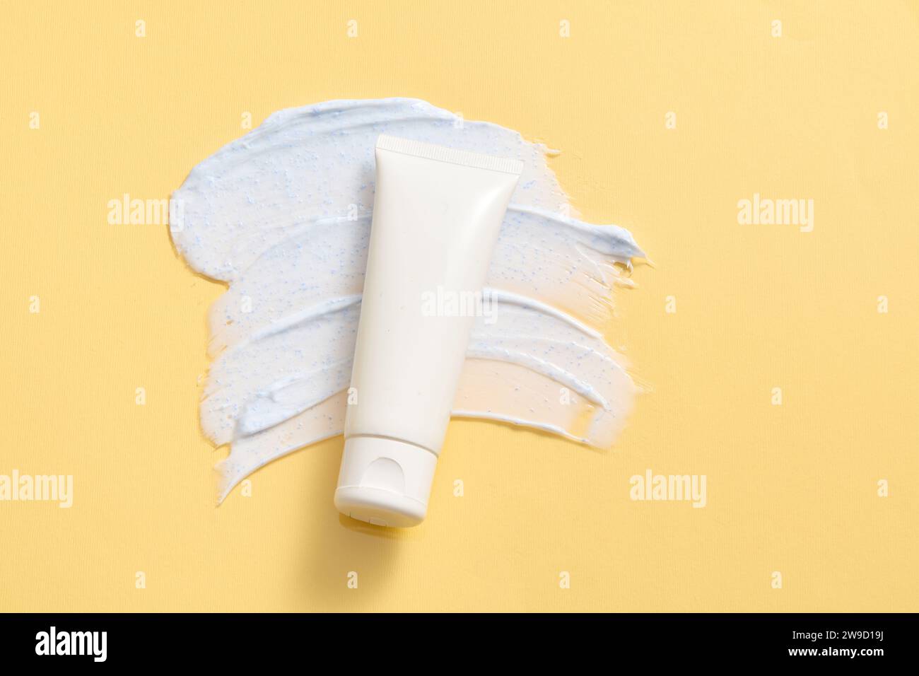 Tube of facial cleanser without label or body cream tube with open cap ...