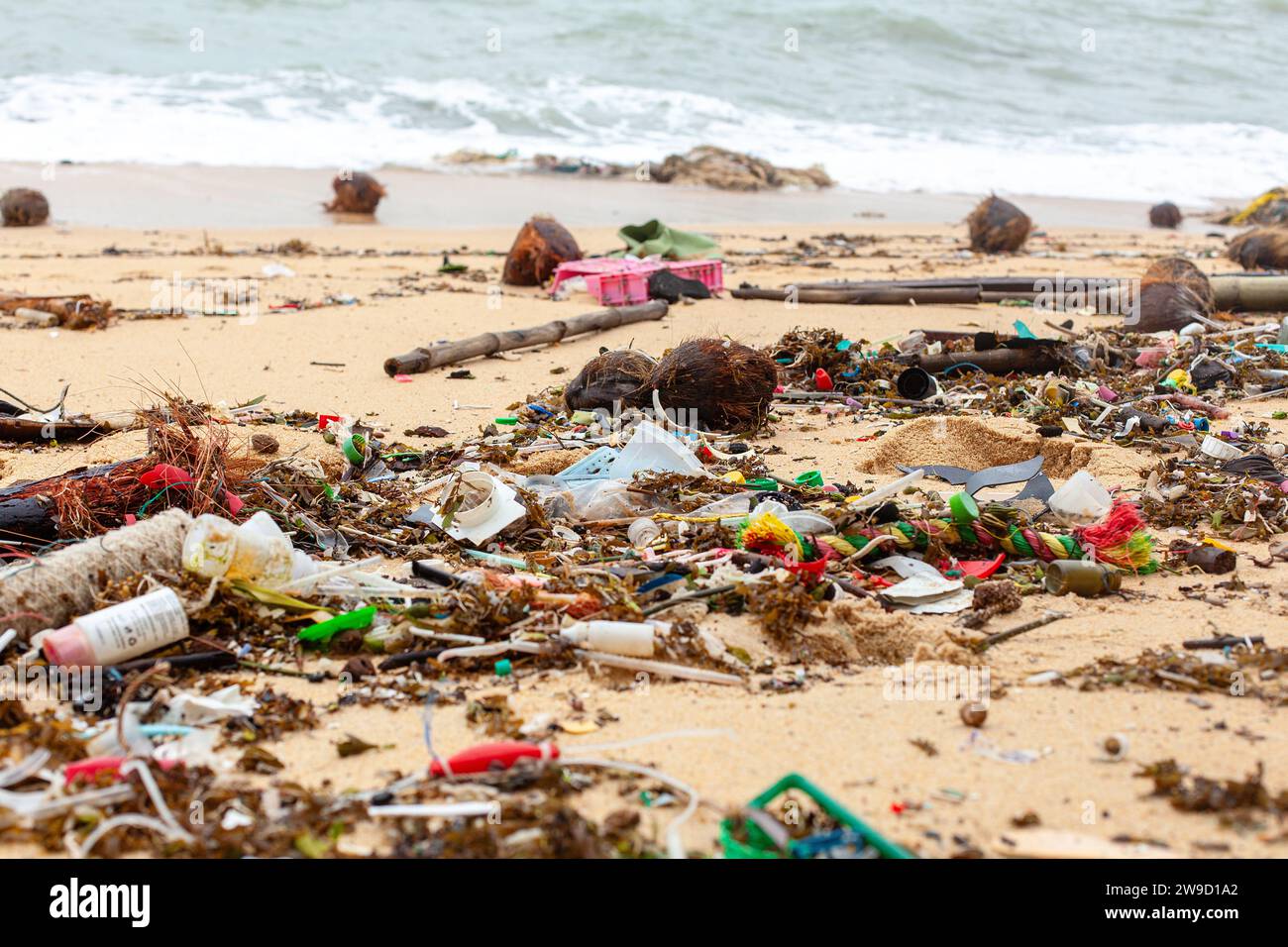 Garbage on sea beach, dirty ocean water, environmental pollution ...