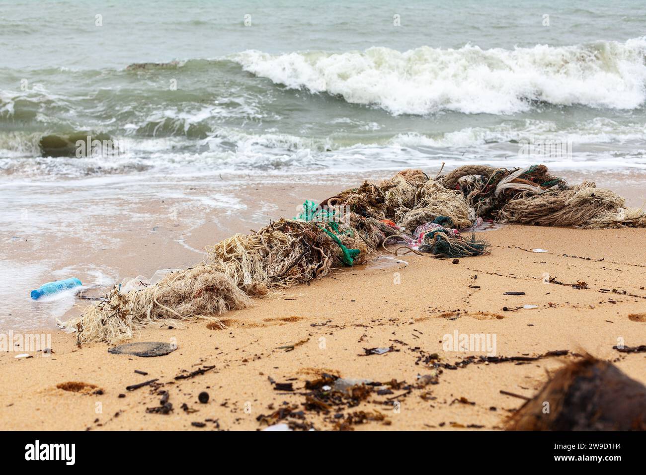 Garbage on sea beach, dirty ocean water, environmental pollution ...