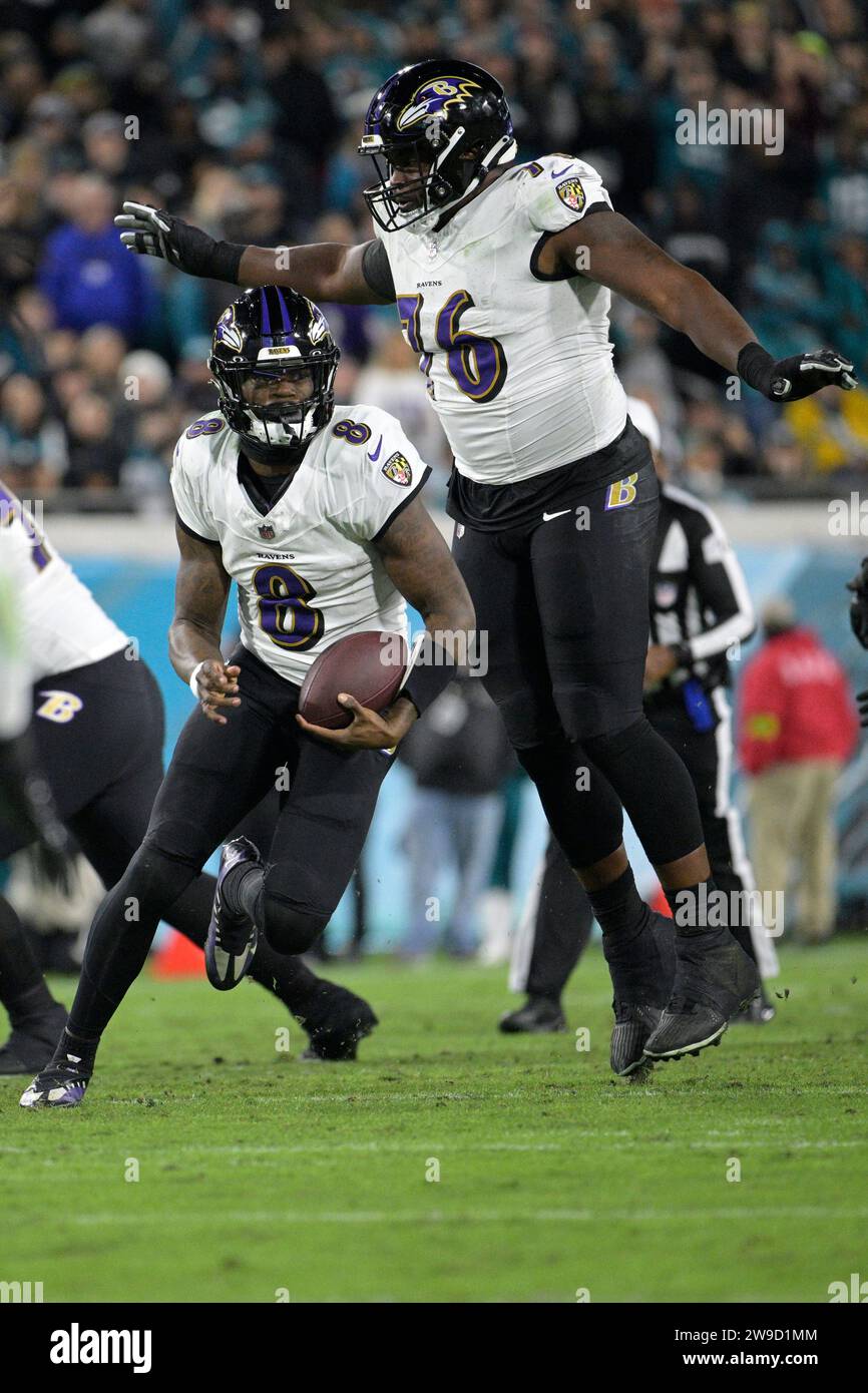 Baltimore Ravens quarterback Lamar Jackson (8) scrambles for yardage in ...