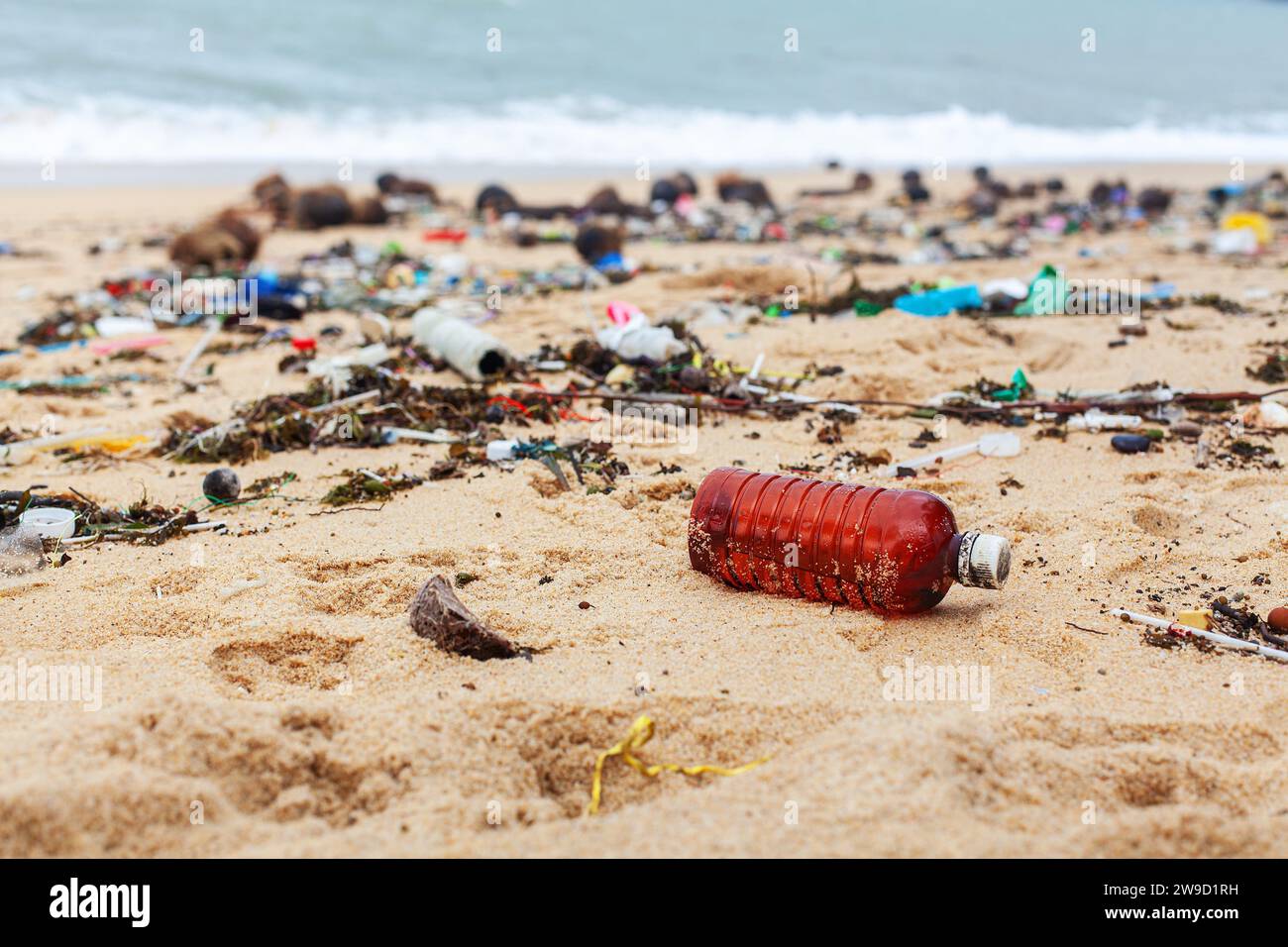 Garbage on sea beach, dirty ocean water, environmental pollution ...
