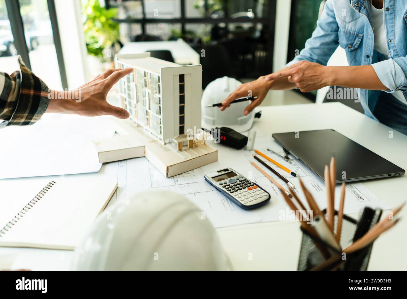 Two engineer discussion and brainstorming about condominium model of ...