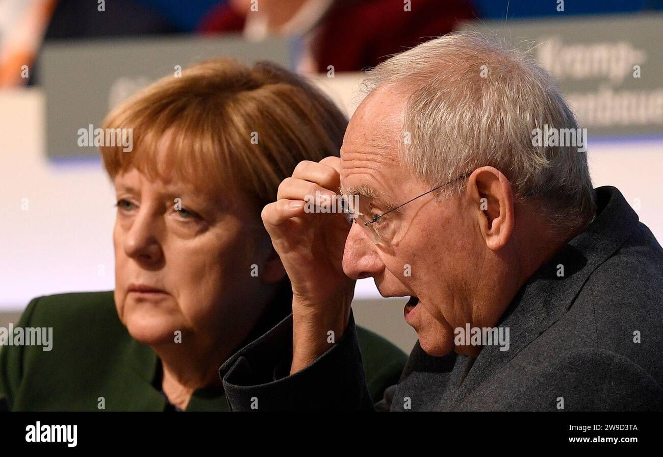 FILE - German Chancellor Angela Merkel, left, and German Finance ...