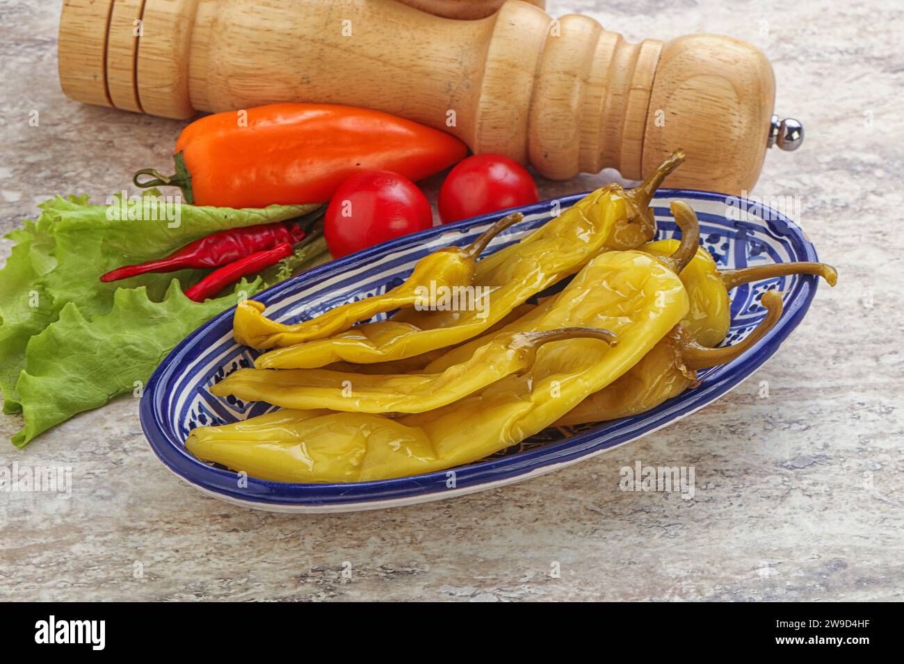 Pickled marinated spicy green pepper snack Stock Photo - Alamy