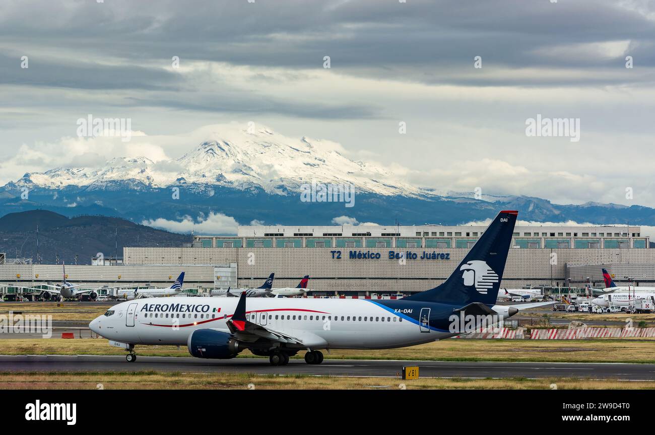 A Boeing 787 Dreamliner Aeromexico airplane taking off from a runway ...
