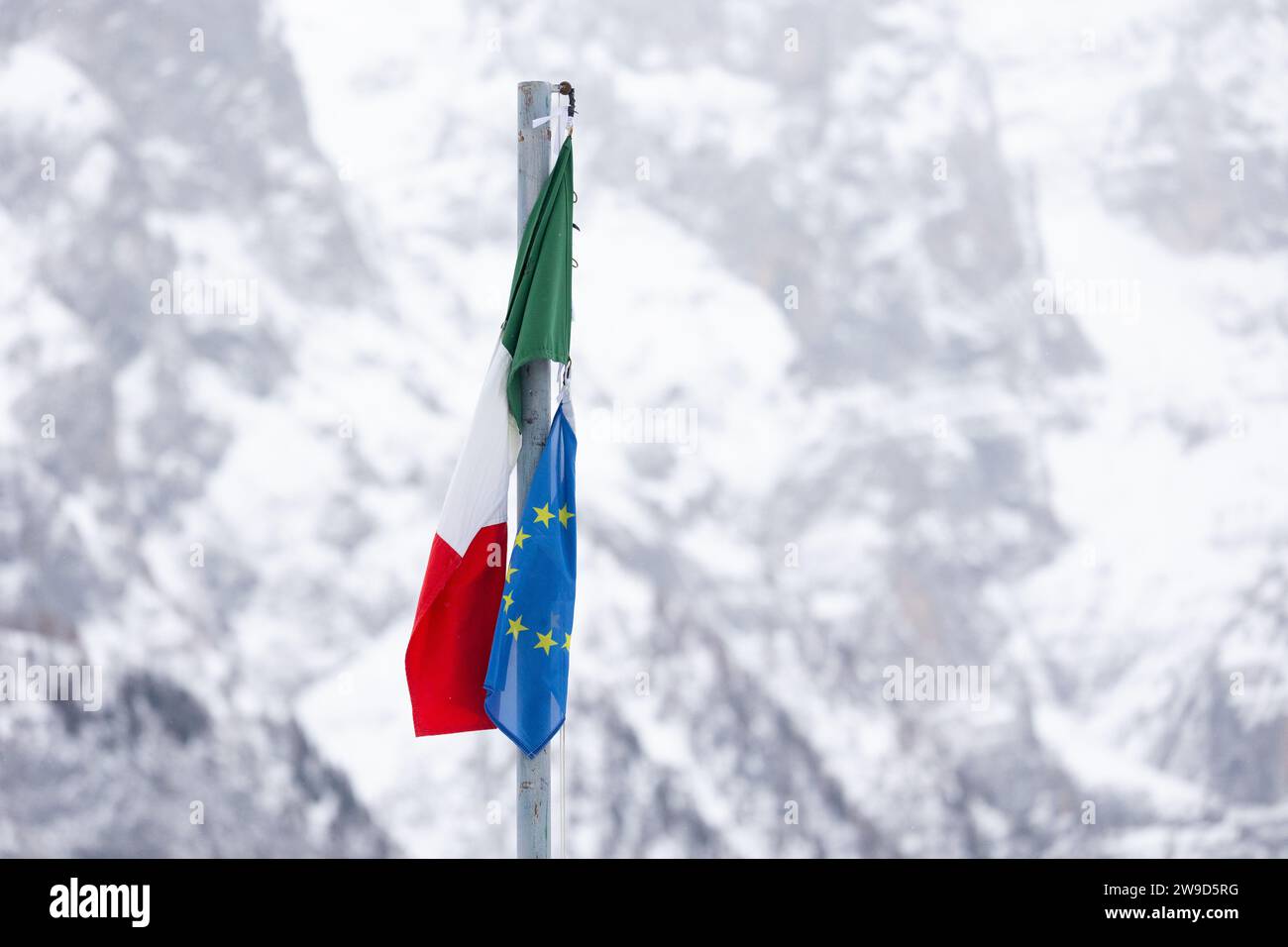 The flags of Italy and the EU (European Union) fly together against the ...