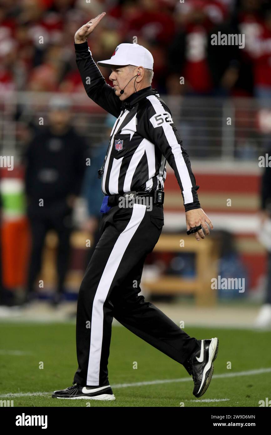 Referee Bill Vinovich signals during an NFL football game between the ...