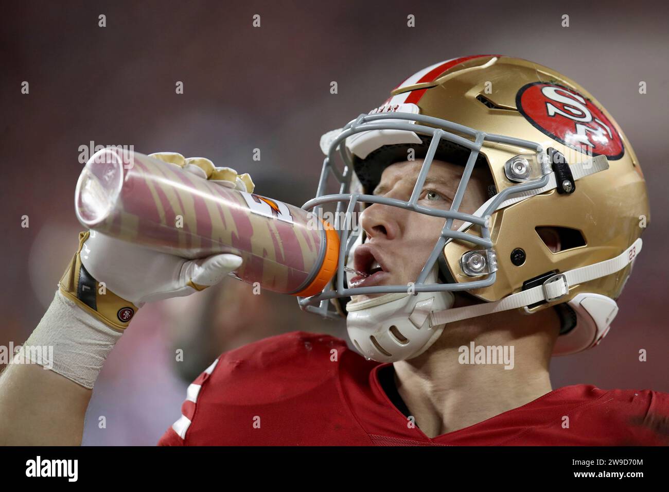 San Francisco 49ers running back Christian McCaffrey (23) drinks ...