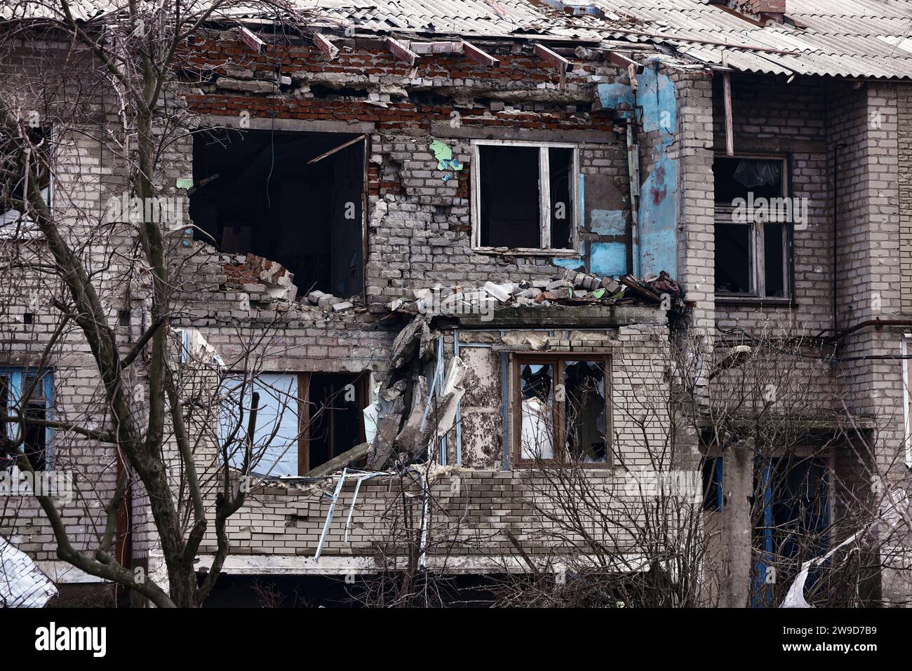 An apartment building in a war zone. Damage to a house as a result of ...