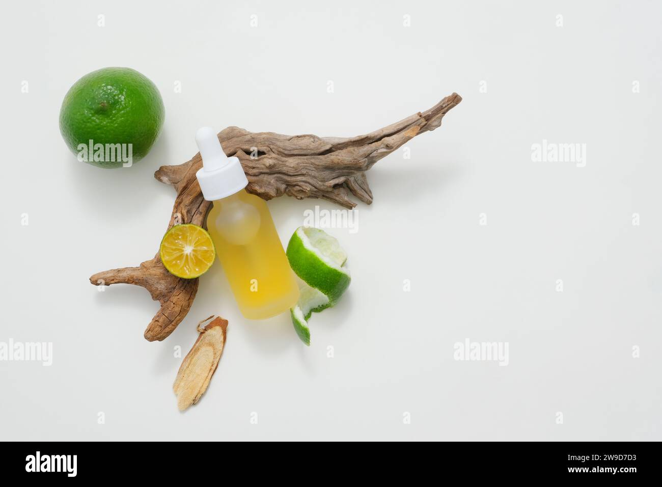 A yellow dropper bottle unbranded displayed on white background with ...