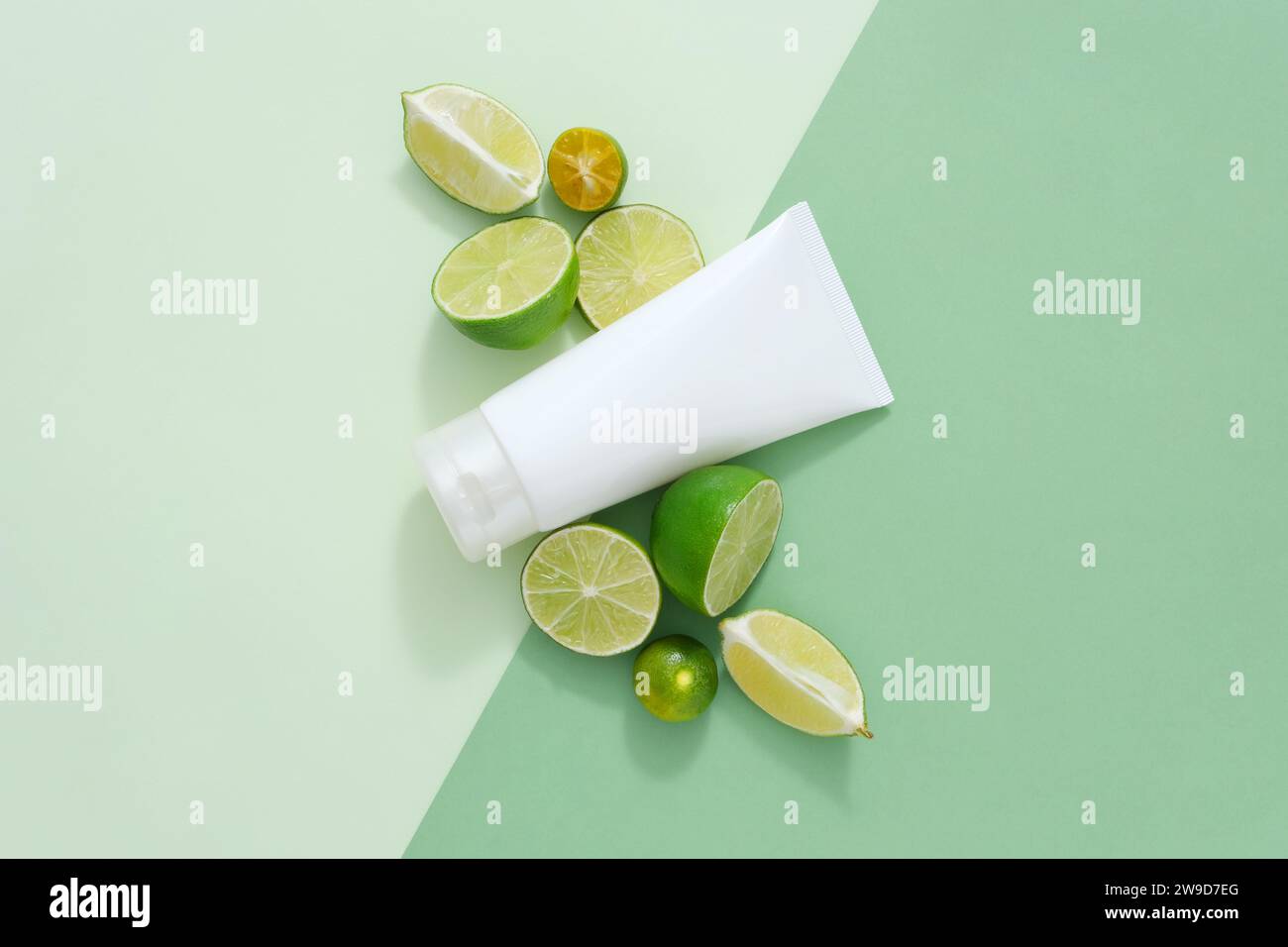 Top view, flat lay of white plastic tube decorated with fresh slices of ...