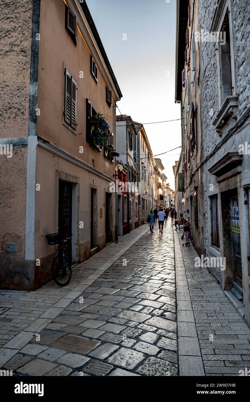 Porec, CROATIA - 14. November 2023: Busy street with shops and ...