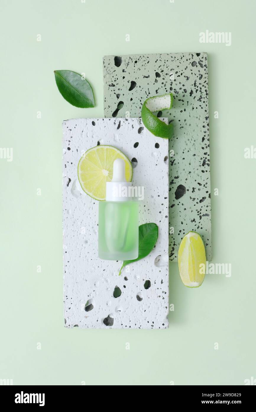 Minimalist concept for advertising cosmetic of lime extract. A dropper ...