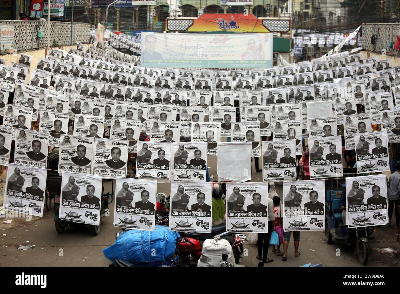Posters of the election candidates are hanging over a street in Dhaka ...