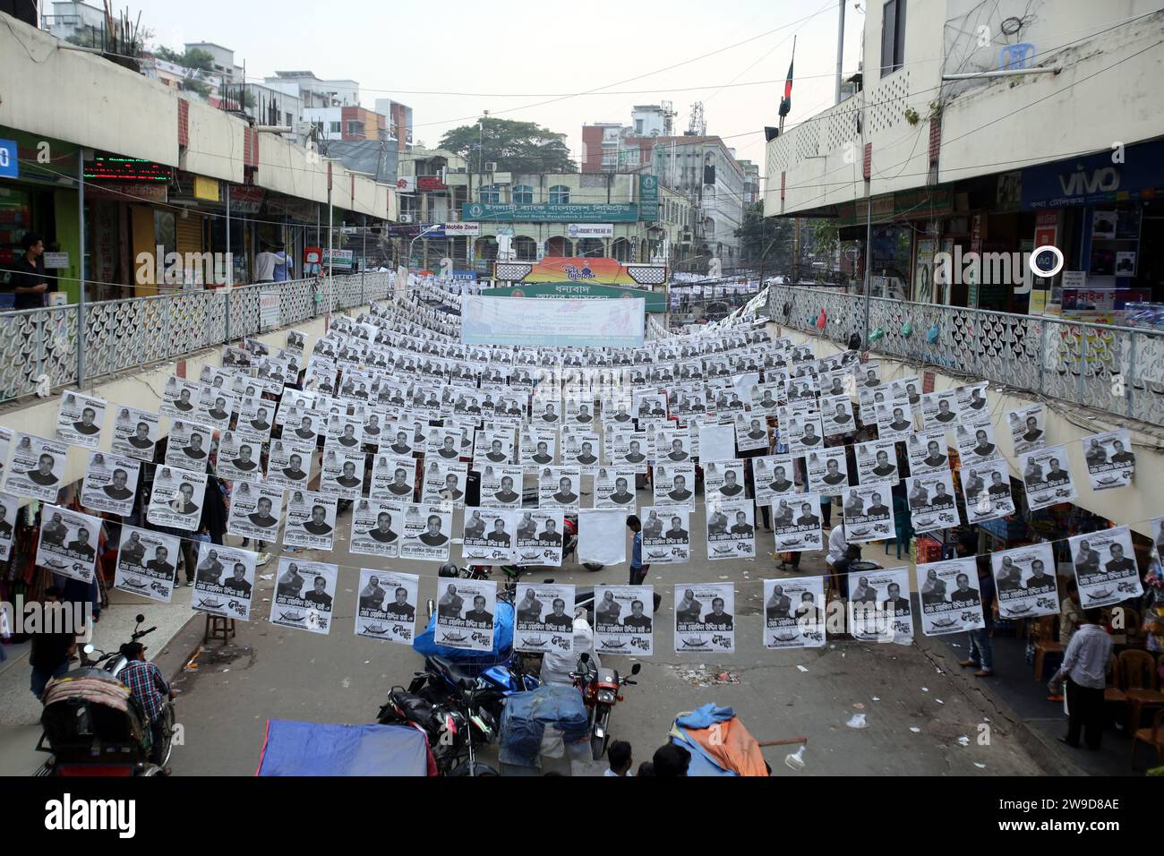 Posters of the election candidates are hanging over a street in Dhaka ...