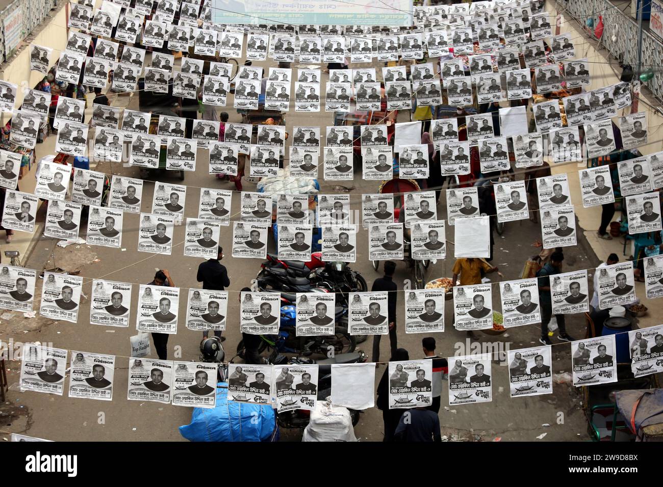 Posters of the election candidates are hanging over a street in Dhaka ...