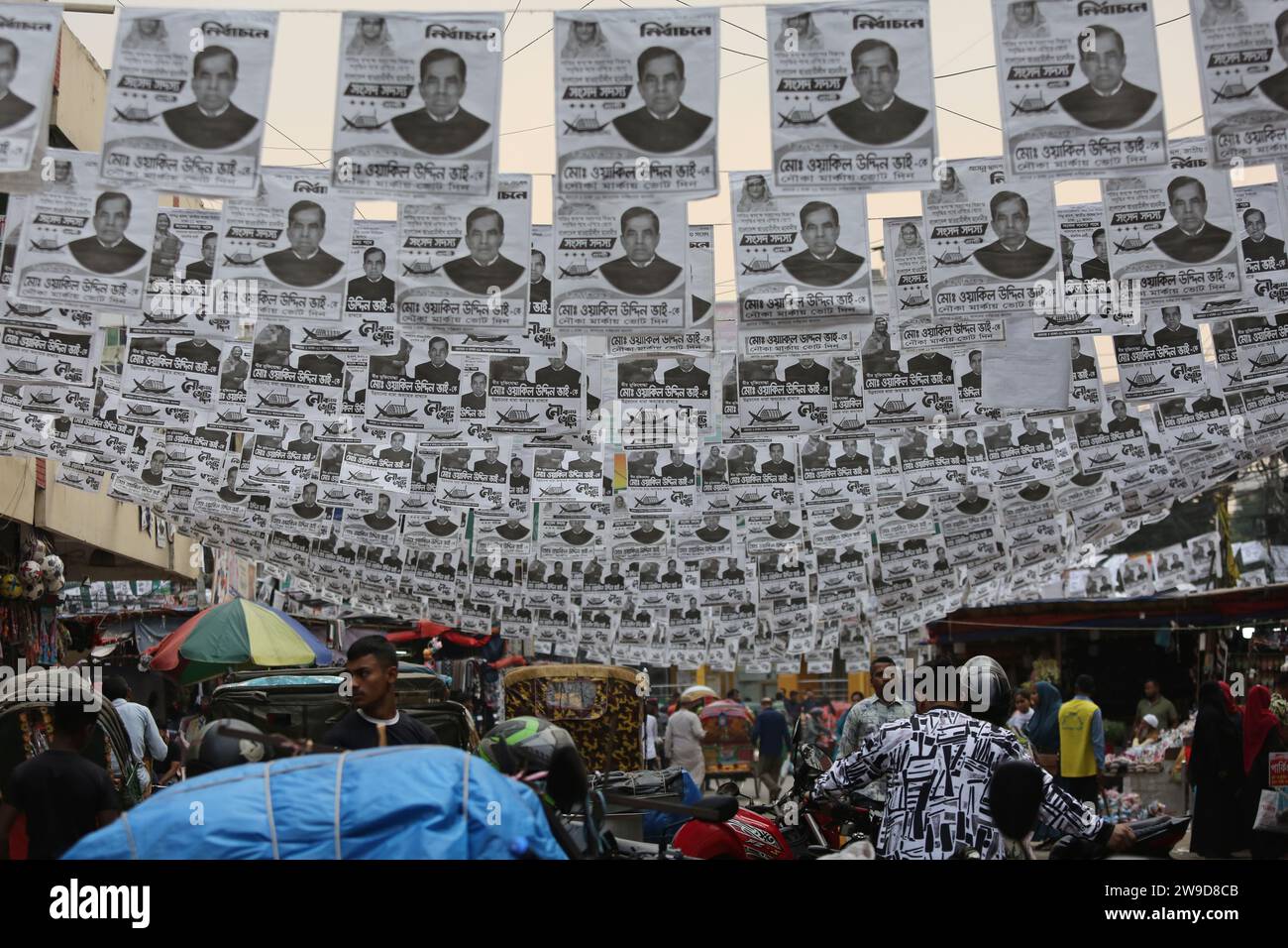 Posters of the election candidates are hanging over a street in Dhaka ...