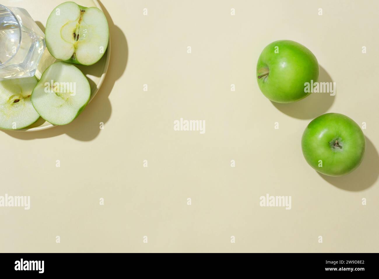 Fresh green apples decorated on beige background. Blank space for ...