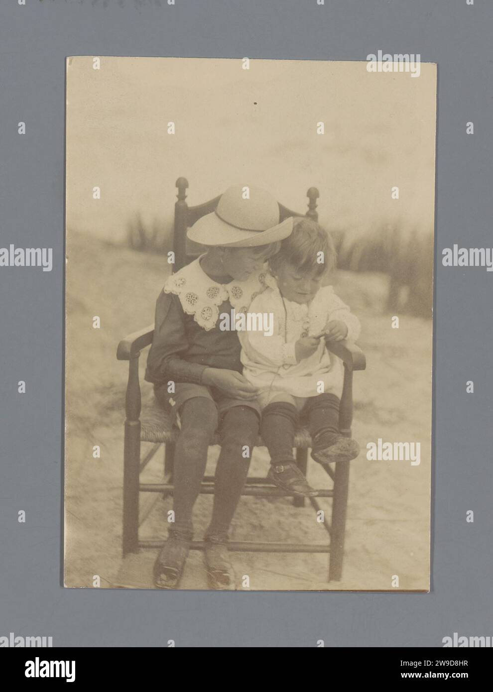 Portrait of two unknown children on a chair in the Duinen, Johannes ...