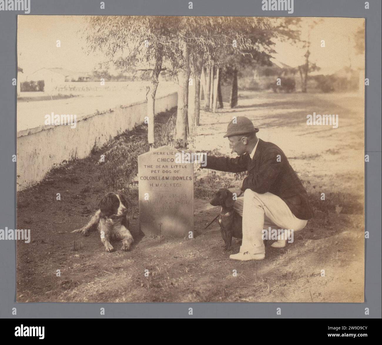 Grave of a dog "Chico", with two dogs and a kneeling man next to it, in ...