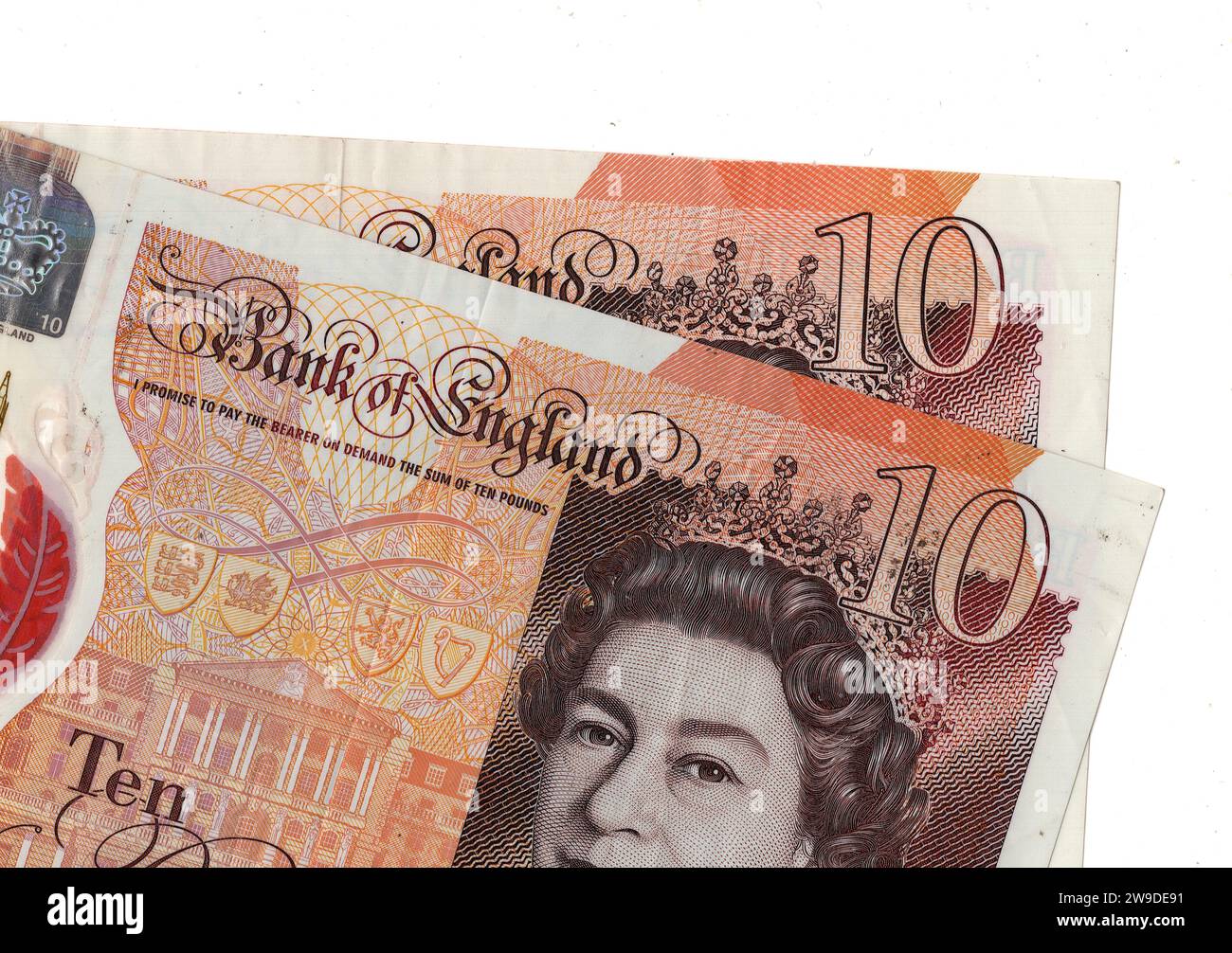 Ten pound notes featuring a portrait of Queen Elizabeth II from the ...