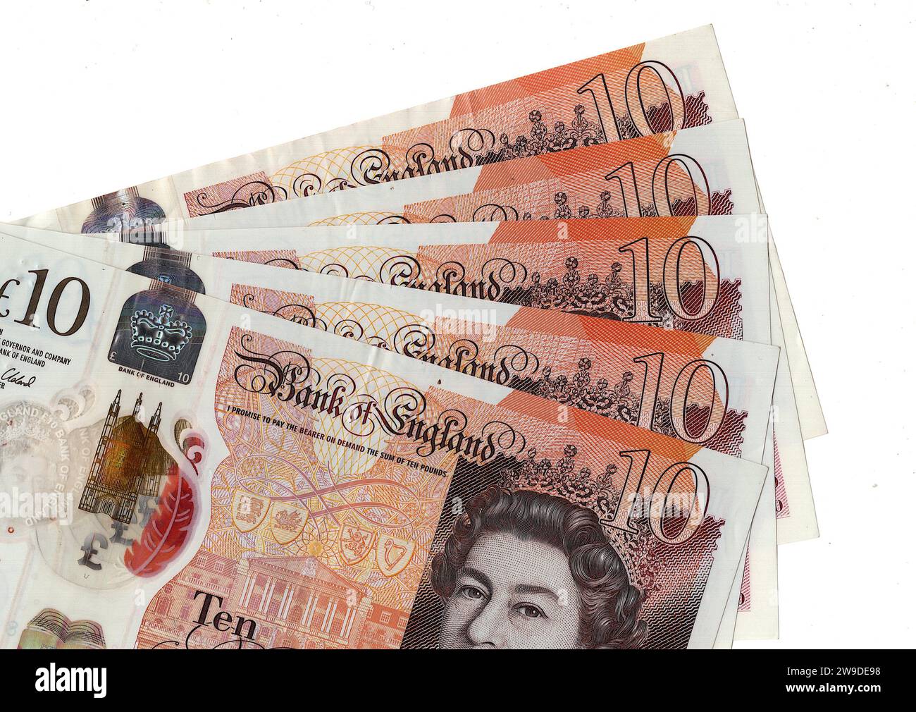 Ten pound notes featuring a portrait of Queen Elizabeth II from the ...