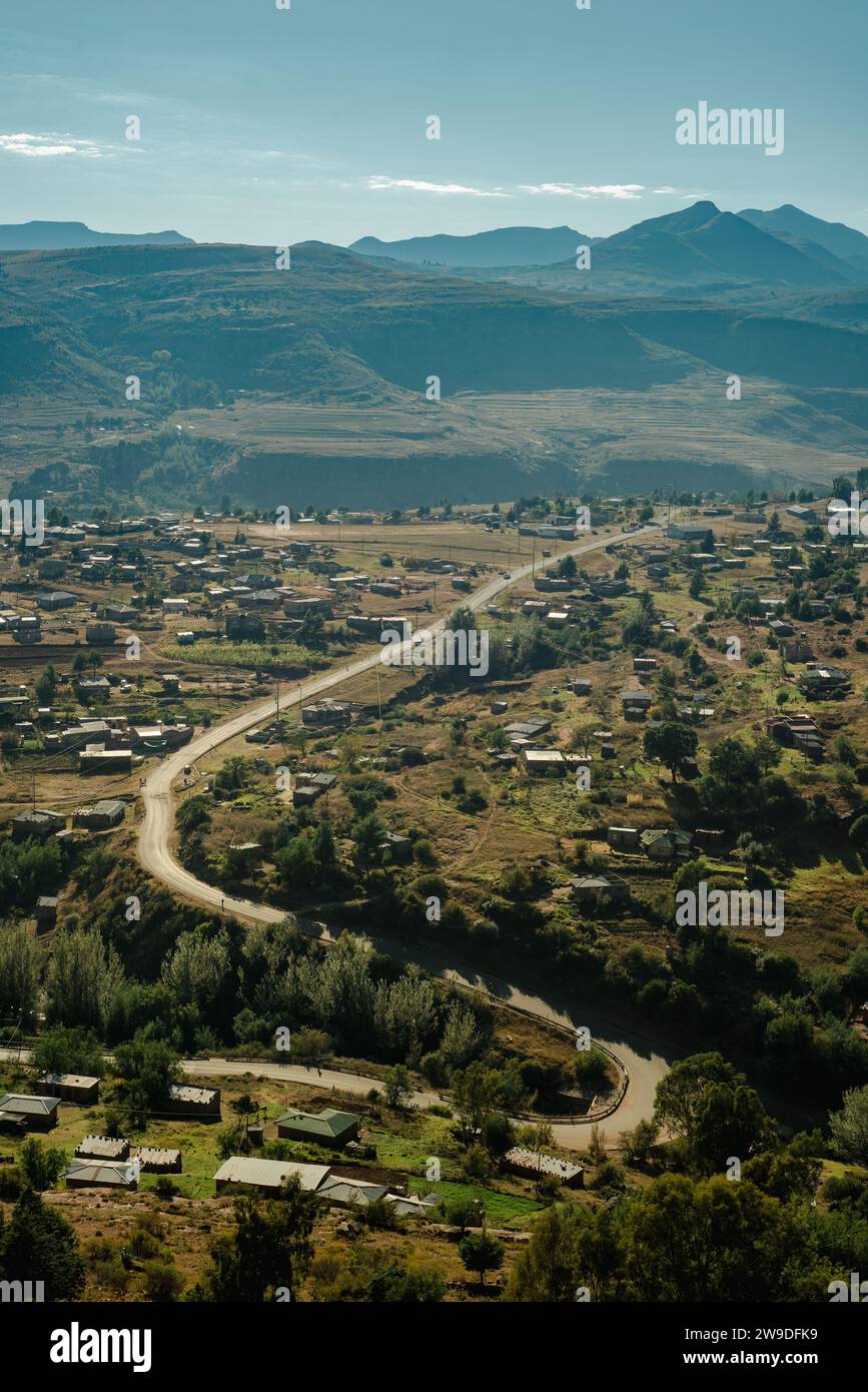 A road winds through the Lesotho town of Quthing towards a horizon of ...