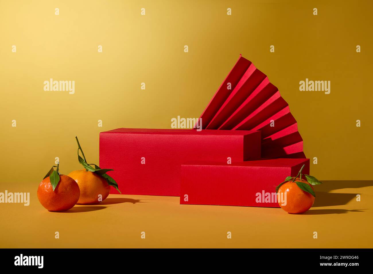 Two red podiums in rectangle shaped displayed with some tangerines and ...