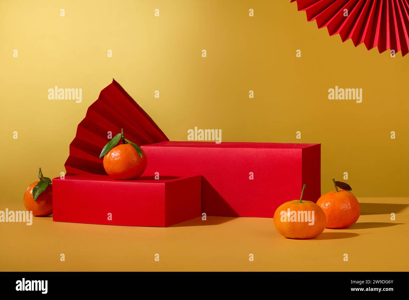 A set of two podiums in red color displayed with handmade paper fan ...