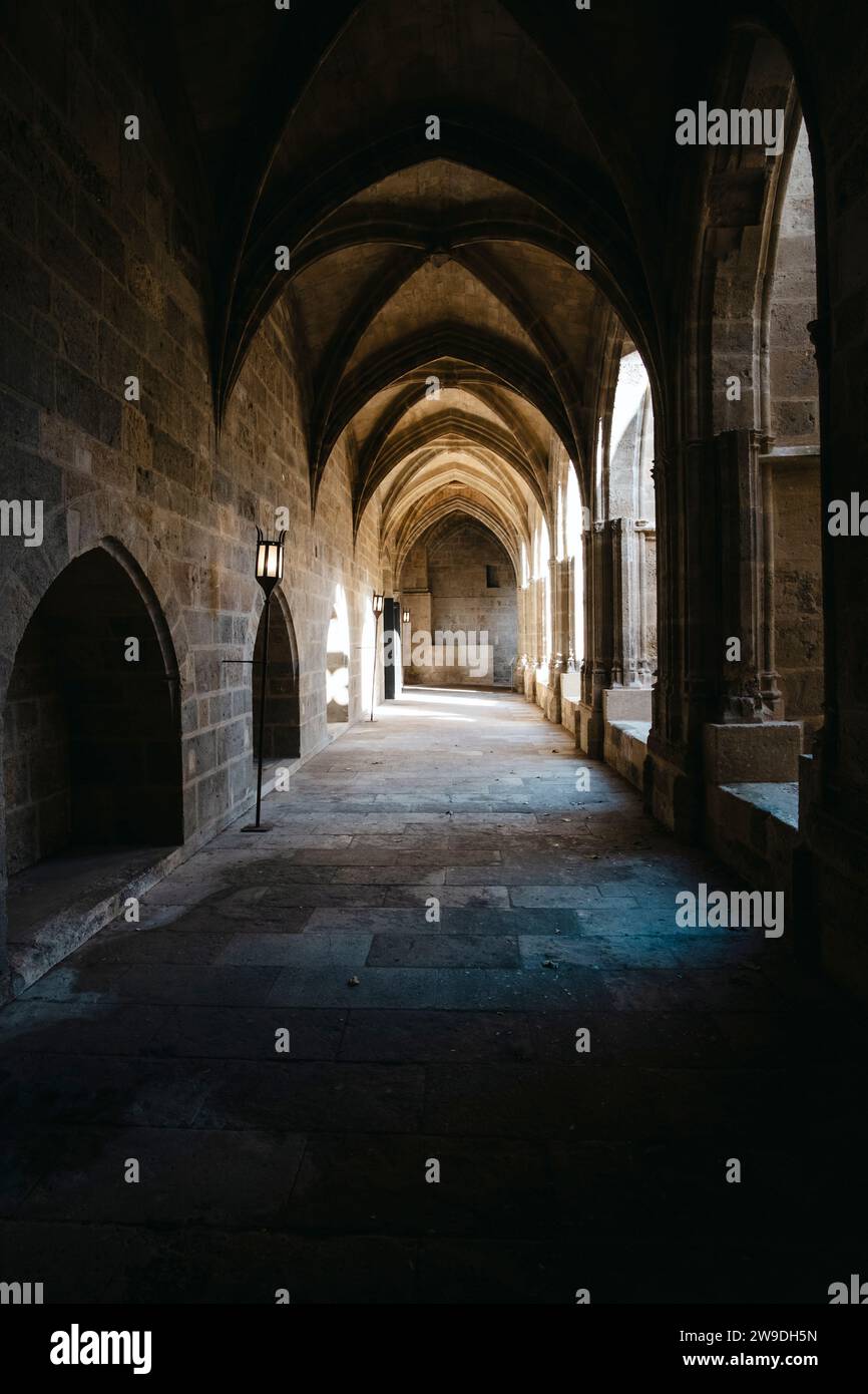 Interior corridor in ancient landmark building with gothic arch in a ...