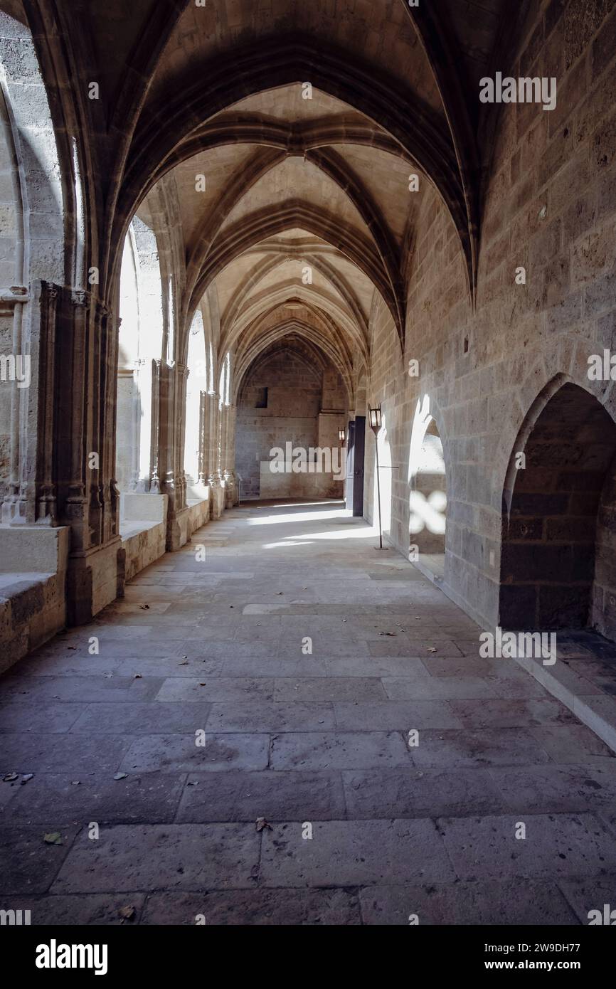 Interior corridor in ancient landmark building with gothic arch in a ...
