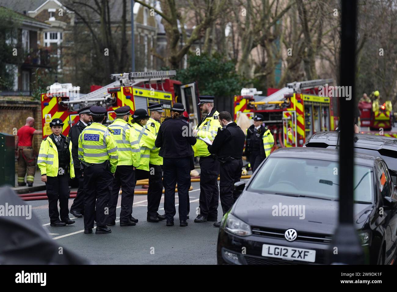 Fire engines and police officers on Seagrave Road in Fulham, west ...