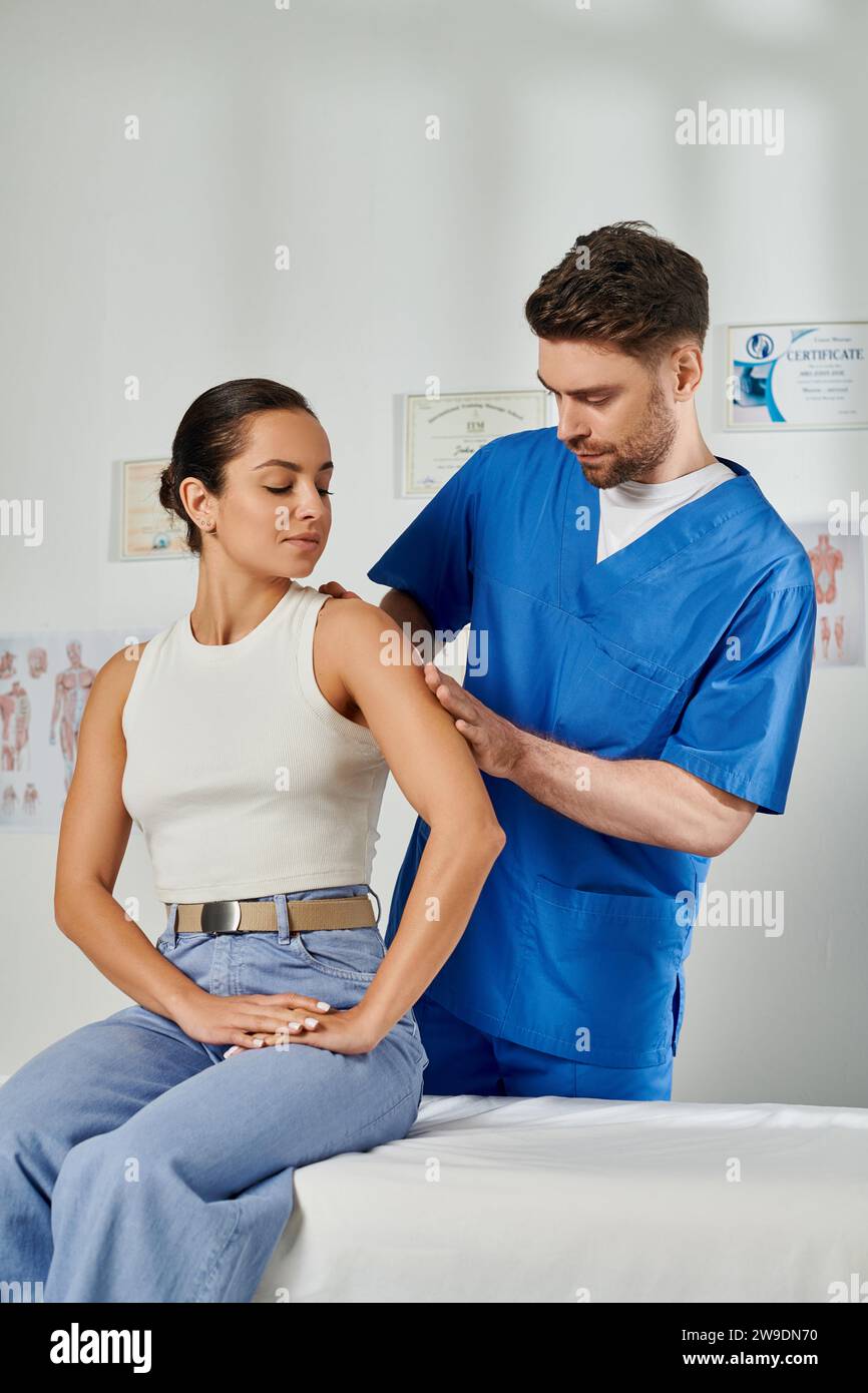 attractive young woman in casual attire watching how doctor checking ...