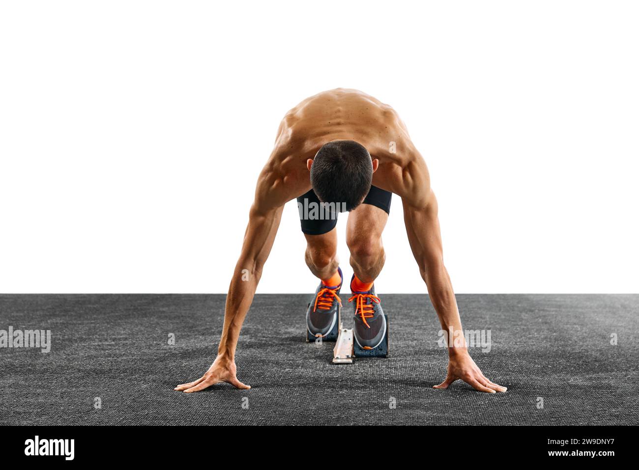 Young athletic man, professional runner preparing before running from ...