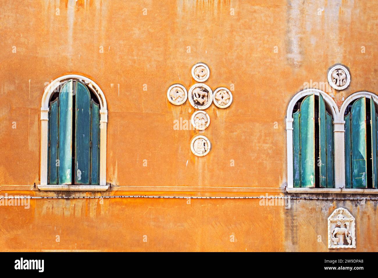 architectural Venetian semicircular windows on a yellow wall. trip to ...