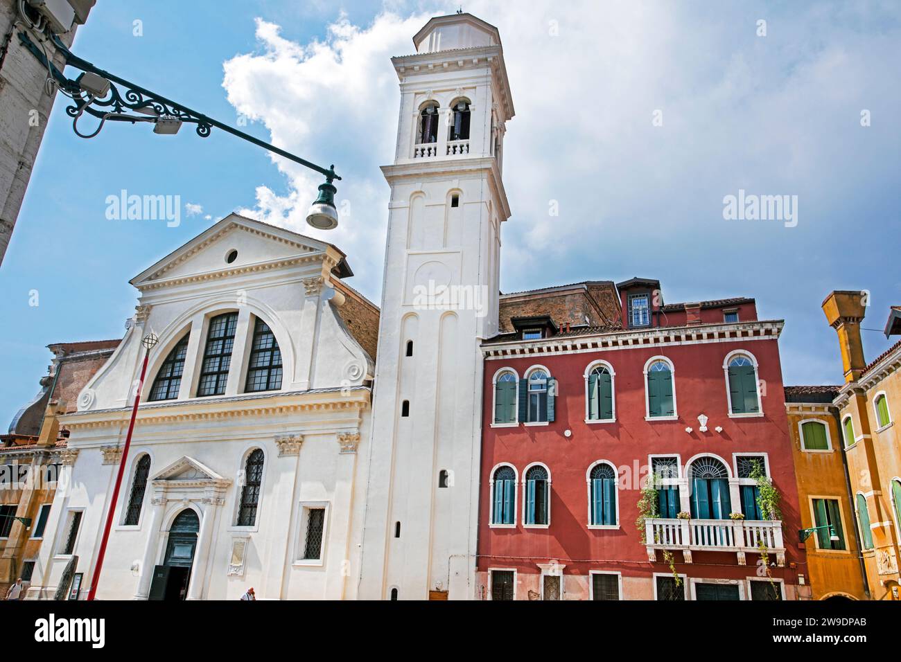 architectural houses with Venetian semicircular windows on a red wall ...
